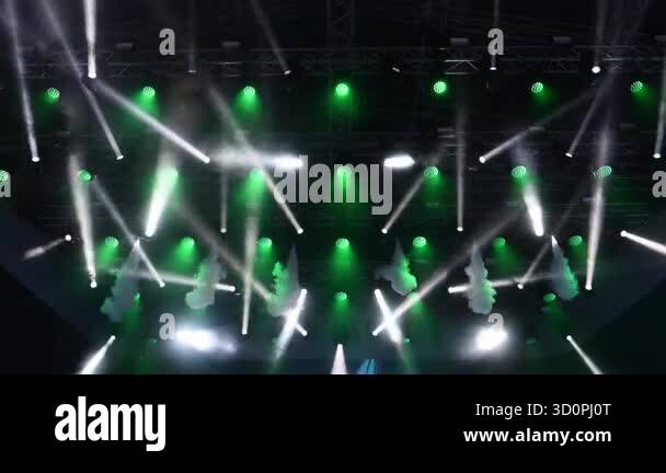 Dynamic light show highlights vibrant stage setup for outdoor concert ...