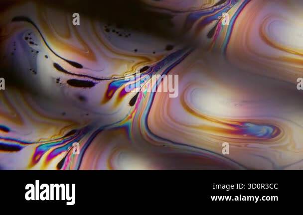 Ink swirl defocused. Iridescent oil. Colorful gasoline light lens on ...