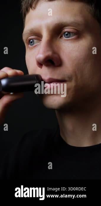 Close up man shaving with electric razor, clean background with copy ...