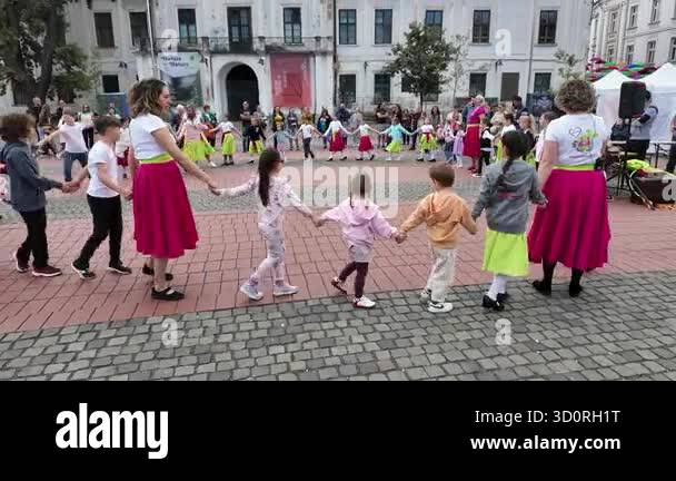 Timisoara, Romania, September 27, 2025, Kids dance in circle and play ...