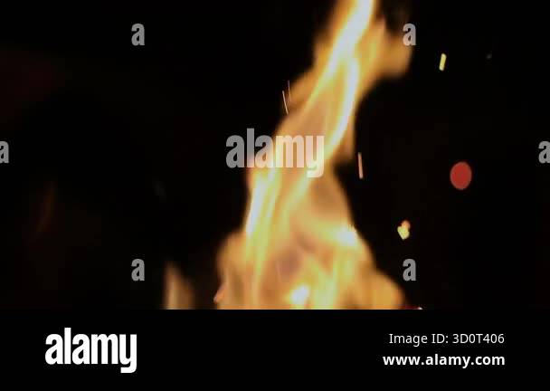 Isolated high flame shape rising vertically against black background in ...