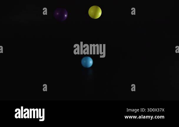 Multiple colored balls bouncing in a dark space Stock Video Footage - Alamy