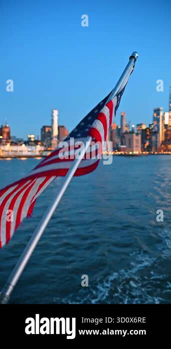 American flag on the ferry in New York. The USA flag waves on the back ...