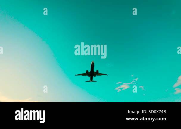 Passenger jet flying in clear sky with sunlight creating scene of safe ...