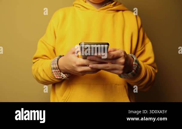 Yellow Vibe. Shaking Hands with a Hanging Android Phone. a person hands ...