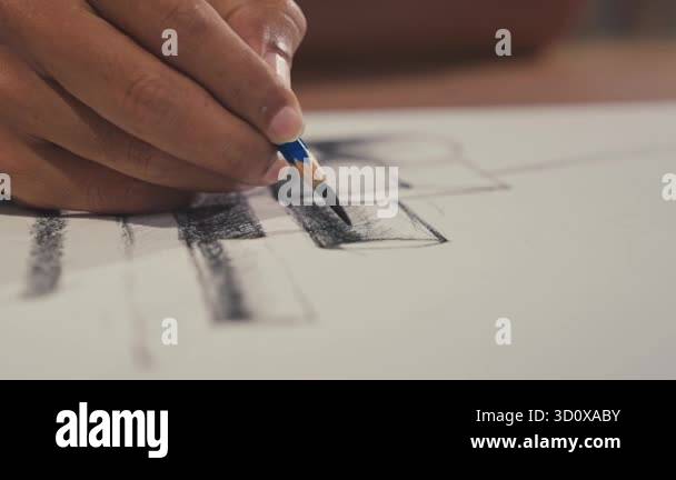 Close up mans hands drawing with pencil on paper Stock Video Footage ...