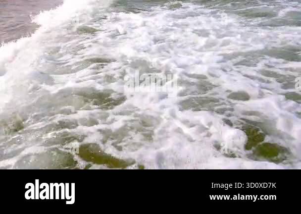 Dynamic ocean waves crashing on shore: surf foam and water reflections ...