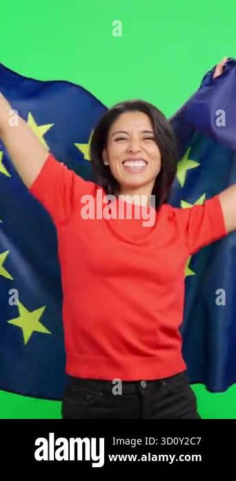 Proud woman waving the European Union flag celebrating on a green ...
