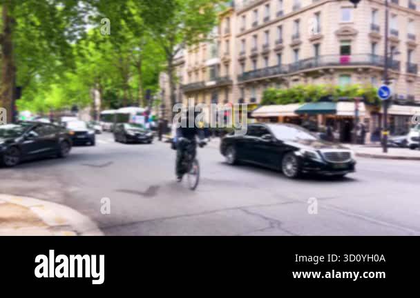 Busy Parisian streets, intersection, pedestrian crossing, people and ...