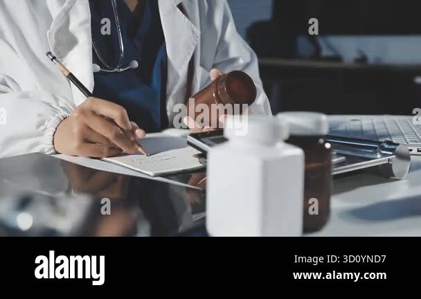 doctor writing on notebook Stock Video Footage - Alamy