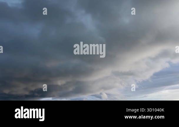 Moving clouds shifting into a dark dramatic stormy sky in a mesmerizing ...