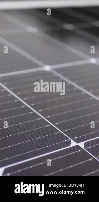 A detailed vertical shot of a solar panel, showcasing its intricate ...