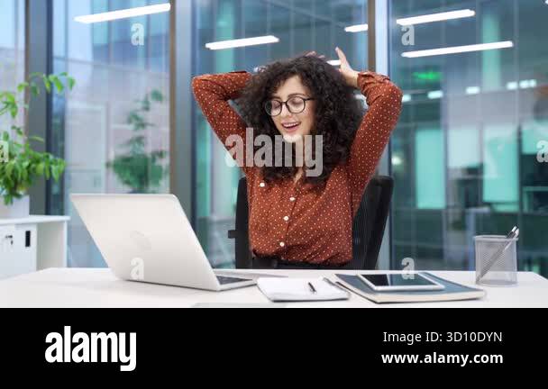 Happy businesswoman finished work on laptop computer while sitting at ...