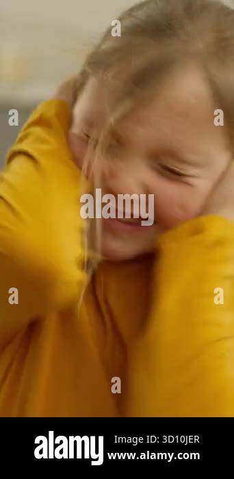 Upset Caucasian little girl child kid daughter covering ears shaking ...