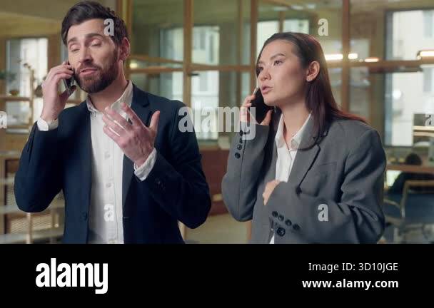 Multinational business partners angry mobile phone calls stress tension ...