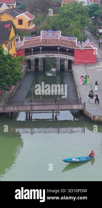 Aerial view of Chua Cau or Japanese Covered ancient Bridge and River in ...