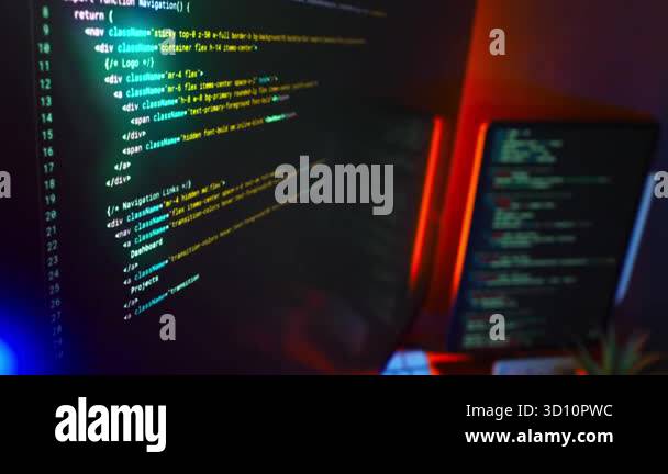 Highlighted software code computer monitor neon workspace. Closeup of vibrant code editor ...