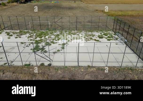 Aerial view of an unfinished stadium area with a fenced perimeter ...
