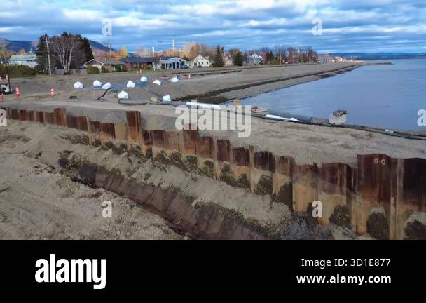 Beach replenishment excavation work to protect against coastal erosion ...