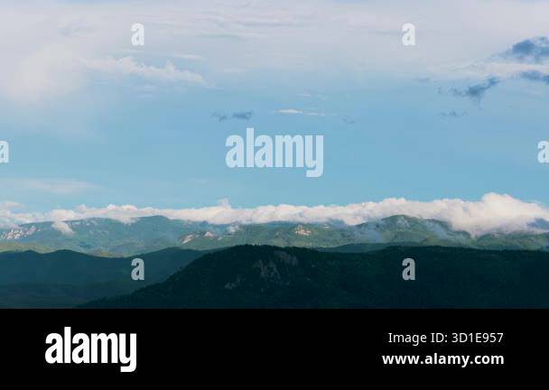 4K aerial view showing gentle slopes, ridges and layers of mountain ...