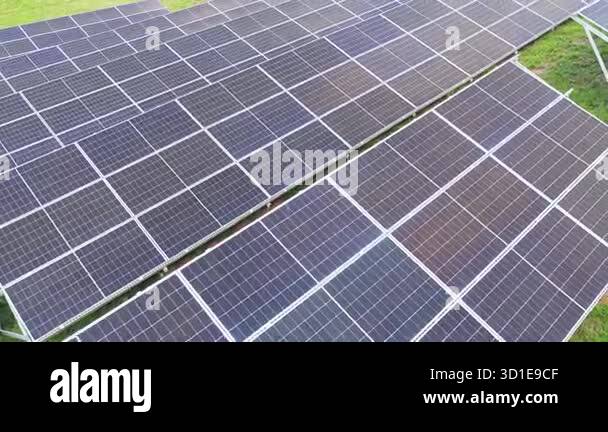 Footage pans right, showing closeup detail of solar panels installed on ...