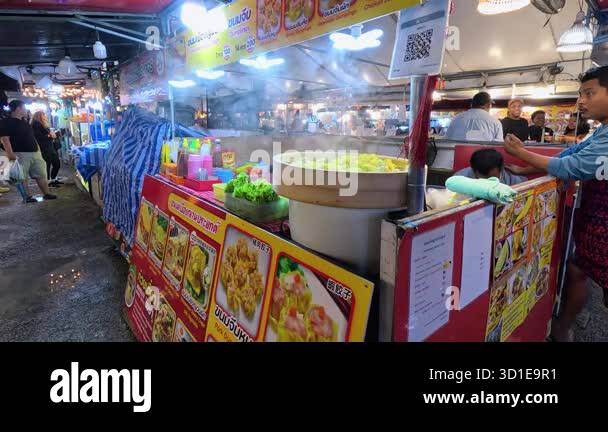 Busy stall selling dumplings at night market Stock Video Footage - Alamy