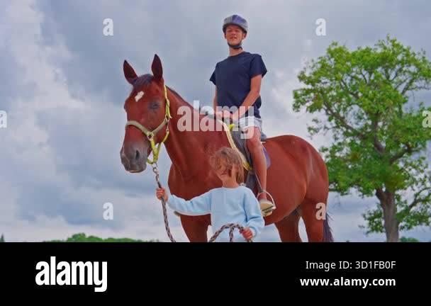 Children interact with the horse in every way during a horseback riding ...