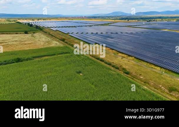Solar energy panels across wide countryside. Aerial panorama of solar ...