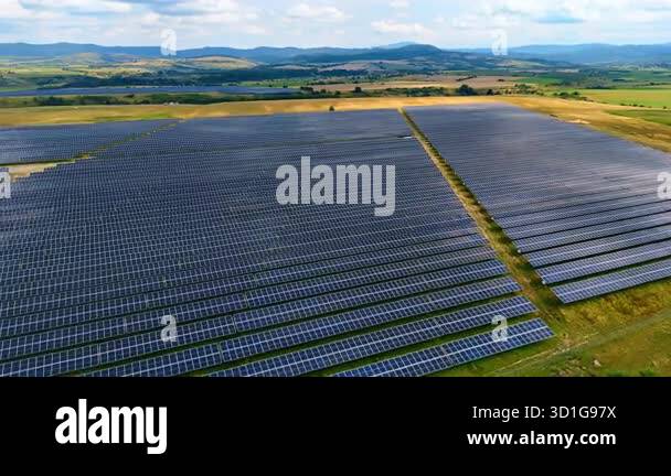 Aerial panorama of green fields and solar panels. Drone shot of solar ...