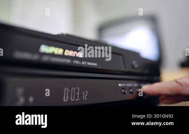 Front panel of the DVD player. Hand presses the button on the device ...