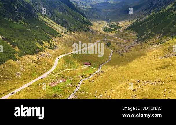 Valley in the mountains crossed by the highway and thin river ...