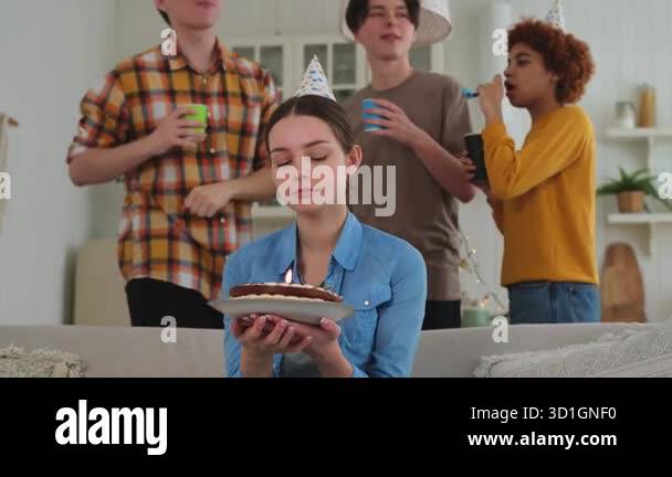 Sad lonely frustrated unhappy young woman looking at birthday cake with ...
