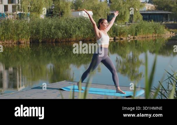 Caucasian young woman standing in lunge fitness exercise sport health ...