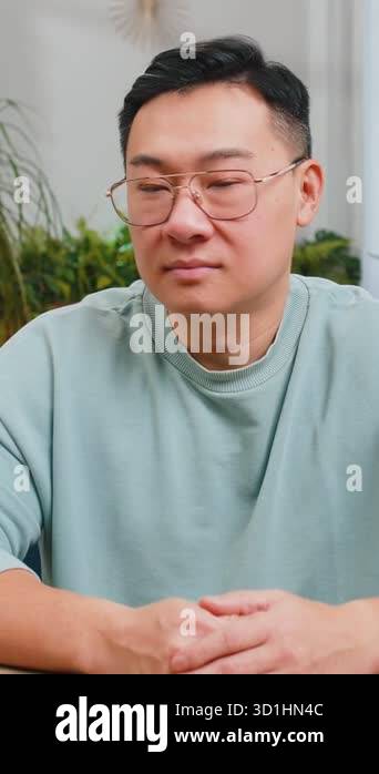 Portrait of happy calm Asian man at home smiling friendly, glad ...