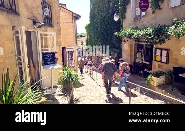 People walking in a charming French alley Stock Video Footage - Alamy