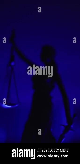 vertical video of bronze law statue represented by blindfolded goddess ...