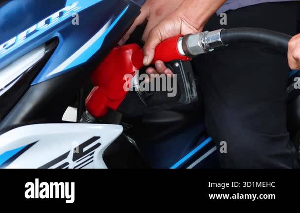 Sequential fueling of a motorcycle by a person Stock Video Footage - Alamy