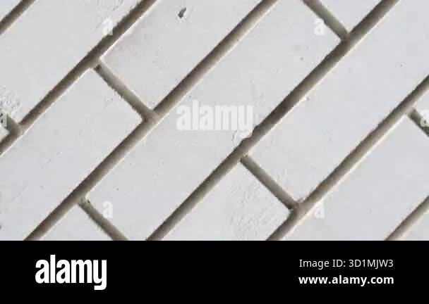 White diagonal brick wall with horizontal masonry lines. Stop motion ...