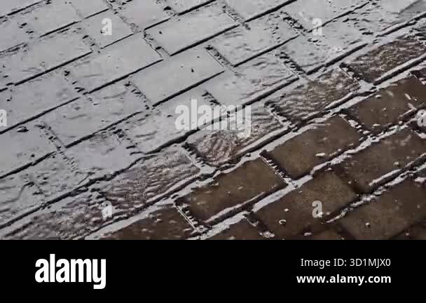 Wet modern cobblestone road during a rainstorm, close-up Stock Video ...