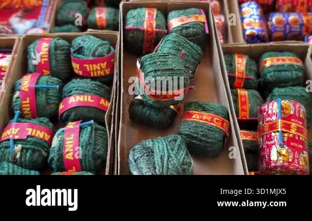 green thread-wrapped bombs and rolled crackers for indian diwali ...