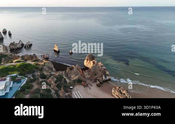 Drone Aerial view of beautiful Praia dos Tres Irmaos beach during ...