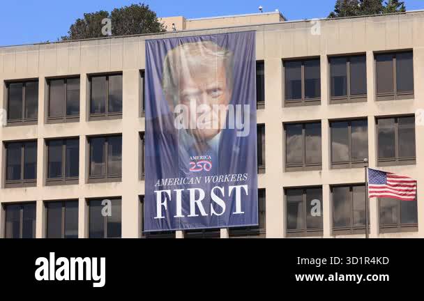 A large banner featuring Donald Trump's face and "American Workers ...