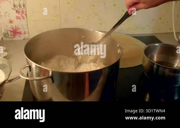 This video showcases cooking, featuring a person stirring pots and ...