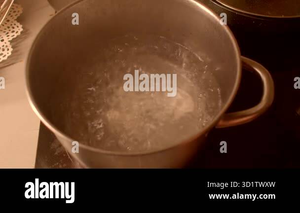The video frames vividly illustrate the entire process of boiling water ...