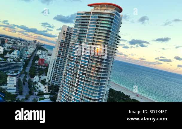 Drone roll inverted flight Miami Beach scene at sunset. Aerial view of ...