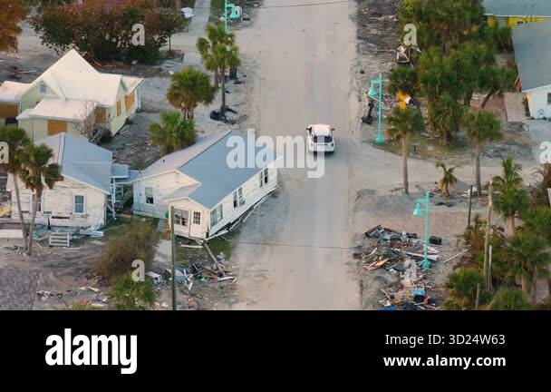 Piles of debris on street side after hurricane Milton on Manasota key ...
