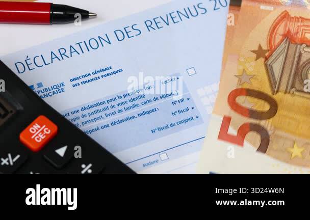 France taxes. Tax return with pen and calculator. Tax calculation. Euro ...