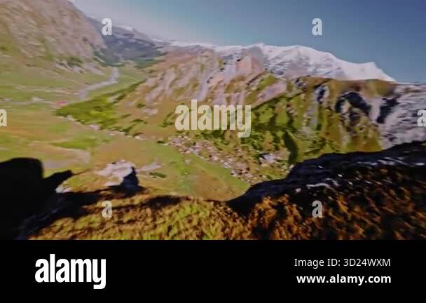 FPV drone flight over sharp mountain cliffs. Aerial view of a cliff ...