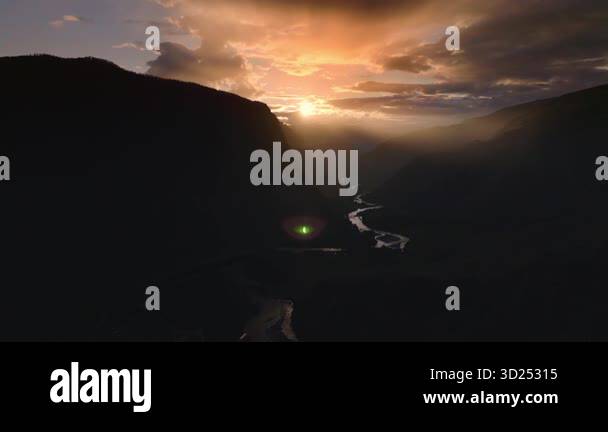 Aerial view. Twilight high above the ground at sunset in the mountains ...