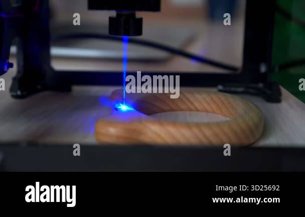Desktop laser wood burning machine uses a blue laser beam to inscribe ...